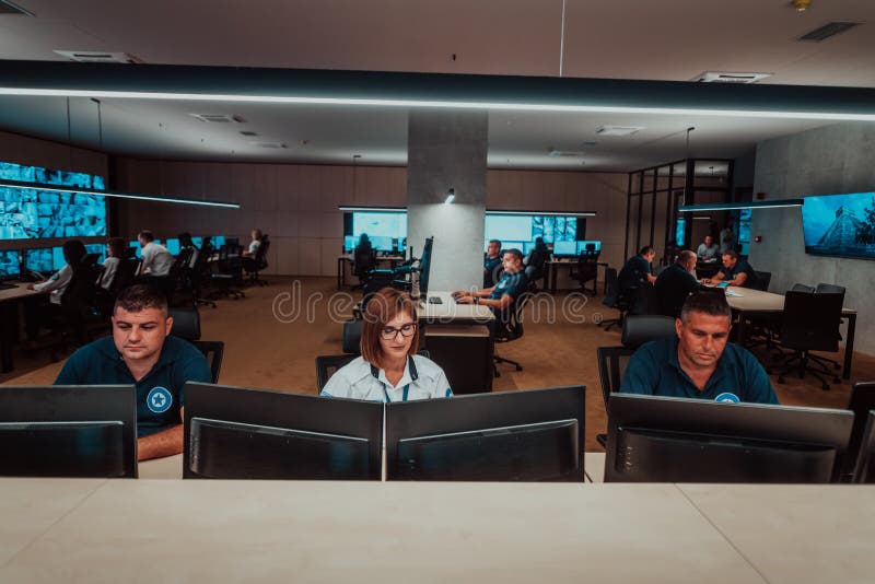 Group of Security Data Center Operators Working in a CCTV Monitoring ...