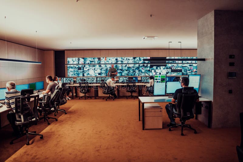 Group of Security Data Center Operators Working in a CCTV Monitoring ... Group of Security Data Center Operators Working in a CCTV Monitoring ...