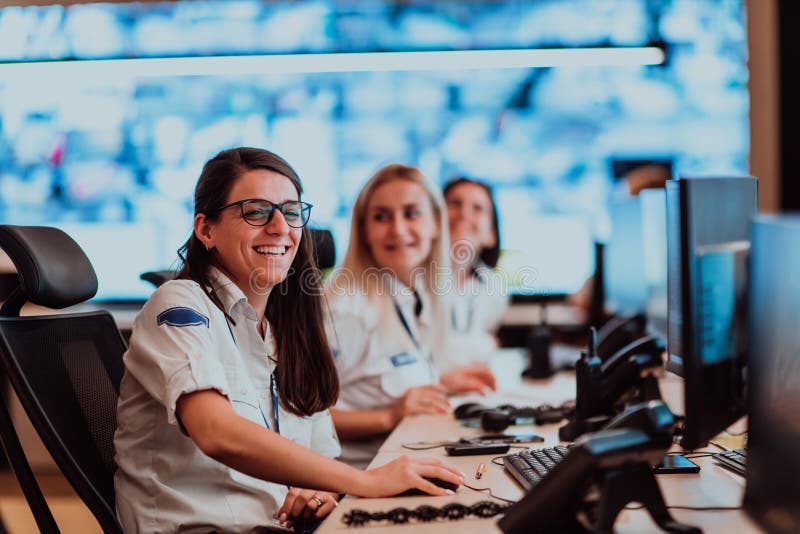 Group of Security Data Center Operators Working in a CCTV Monitoring ... Group of Security Data Center Operators Working in a CCTV Monitoring ...