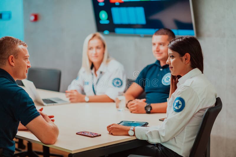 Group of Security Guards Sitting and Having Briefing in the System ...
