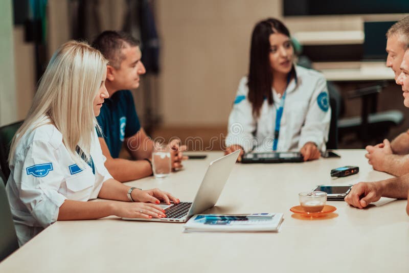 Group of Security Guards Sitting and Having Briefing in the System ...
