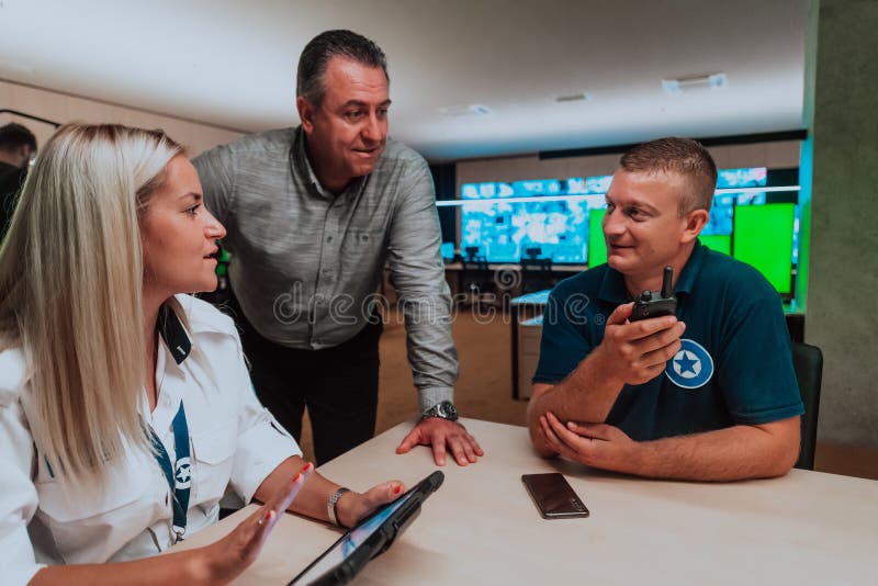 Group of Security Guards Sitting and Having Briefing in the System ...