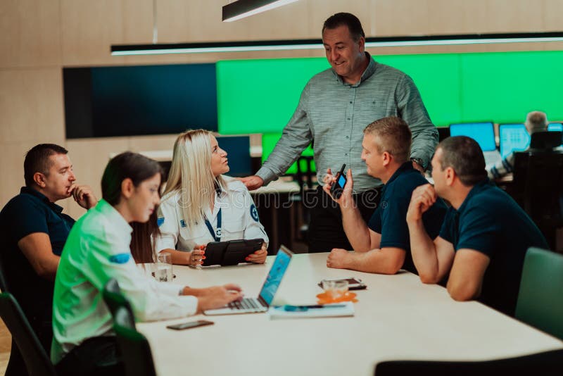 Group of Security Guards Sitting and Having Briefing in the System ...