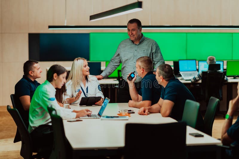 Group of Security Guards Sitting and Having Briefing in the System ...
