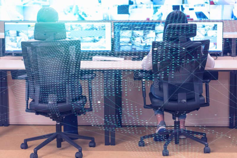 Group Of Security Guards Working On Computers While Sitting In The Main ...