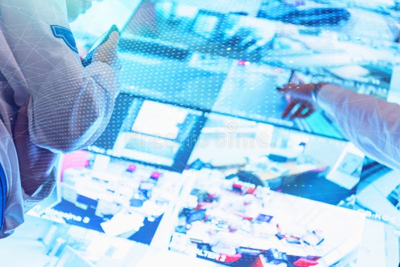 Group of Security Guards Working on Computers while Sitting in the Main ...