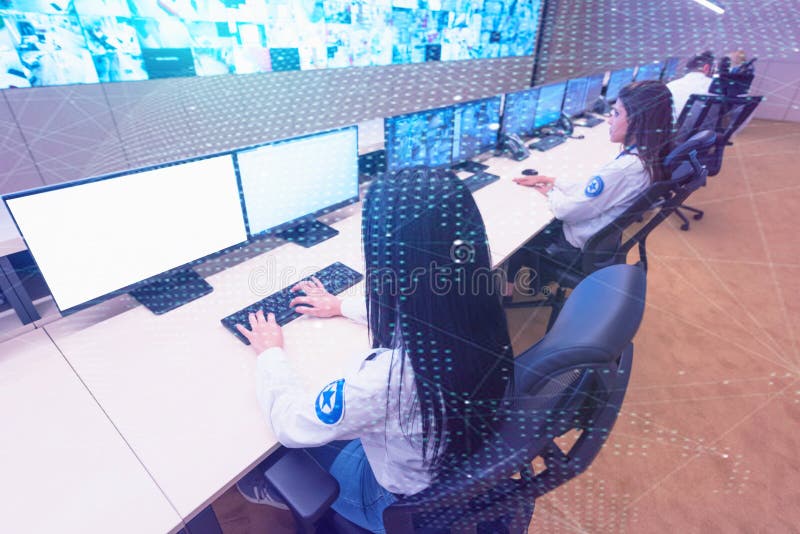 Group of Security Guards Working on Computers while Sitting in the Main ...