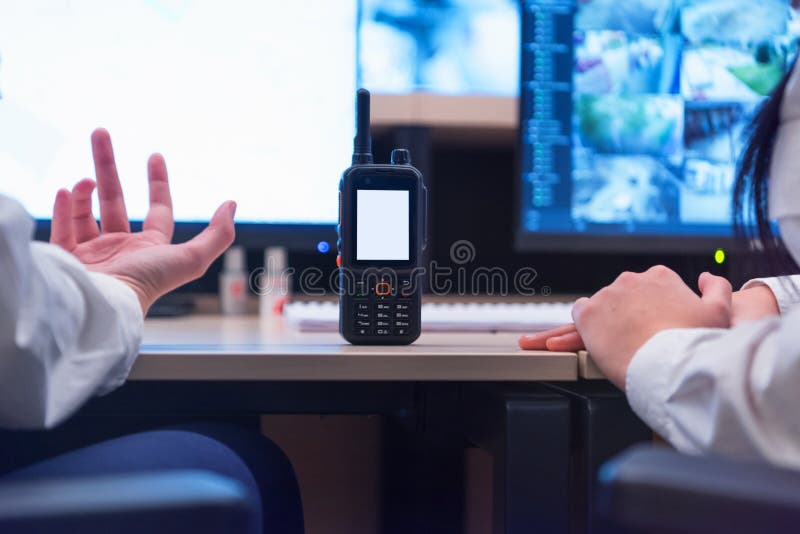 Group of Security Guards Working on Computers while Sitting in the Main ...