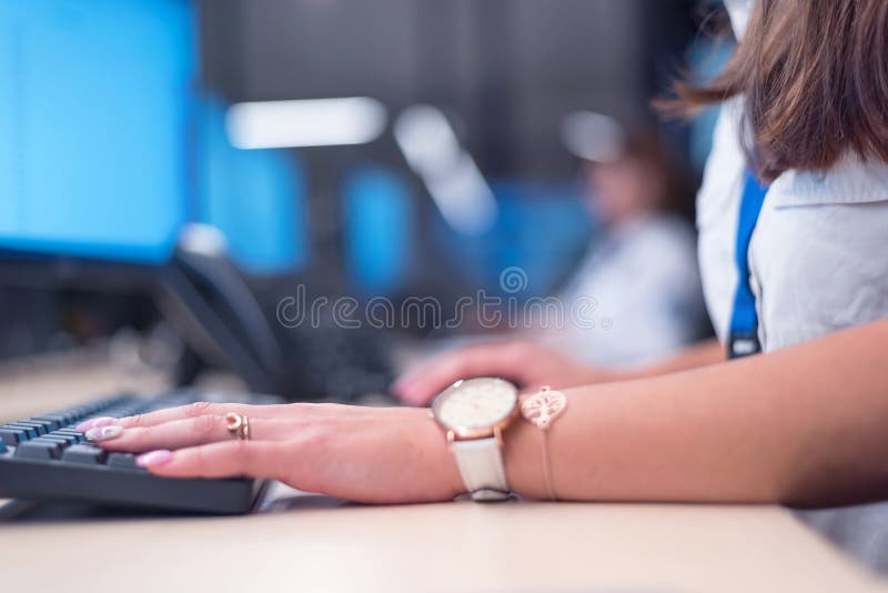 Group of Security Guards Working on Computers while Sitting in the Main ...