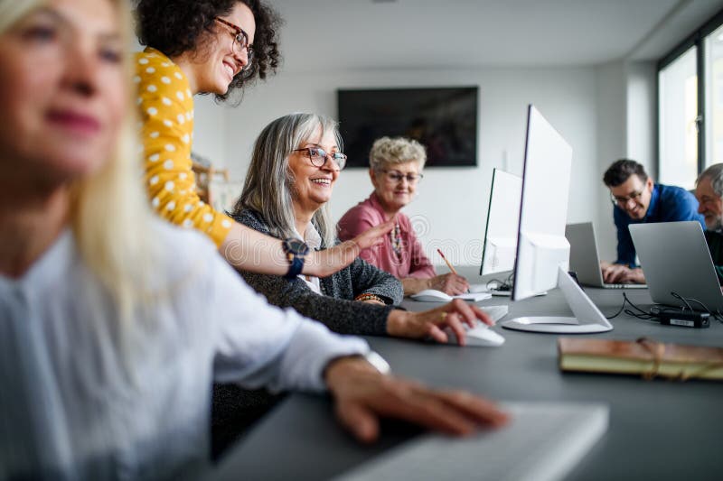 Group of Senior People Attending Computer and Technology Education ...