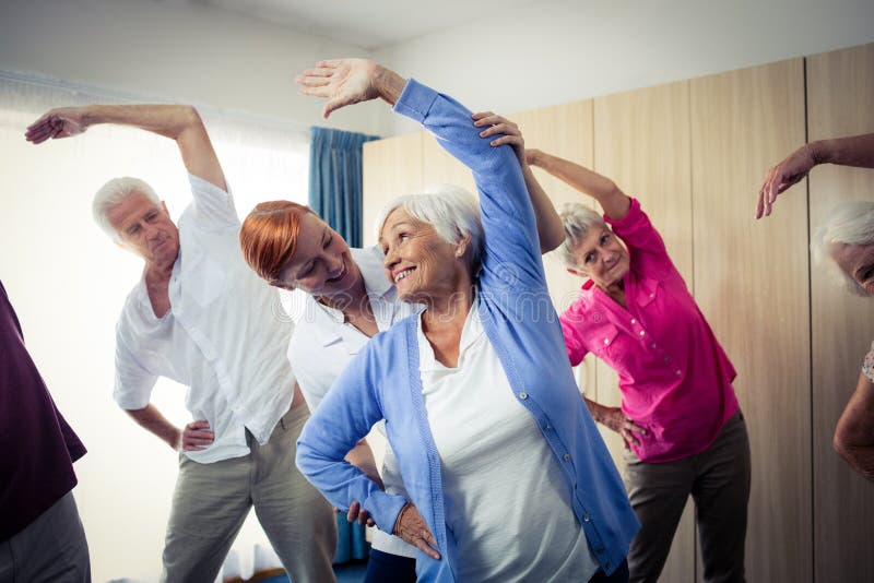 Group of Seniors Doing Exercises with Nurse Stock Photo - Image of ...