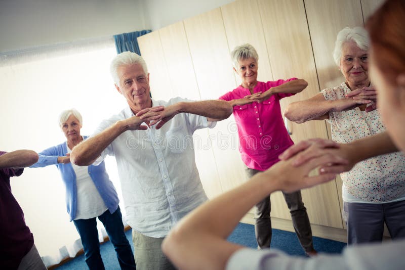 Group of Seniors Doing Exercises with Nurse Stock Image - Image of ...