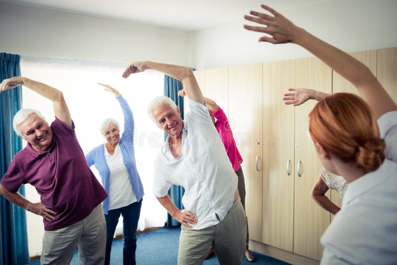 Group of Seniors Doing Exercises with Nurse Stock Image - Image of ...