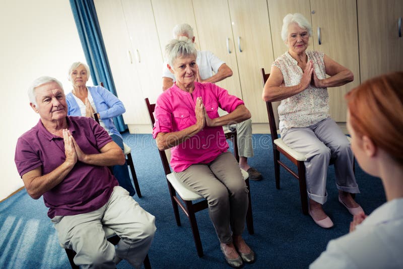 Group of Seniors Doing Exercises with Nurse Stock Photo - Image of ...