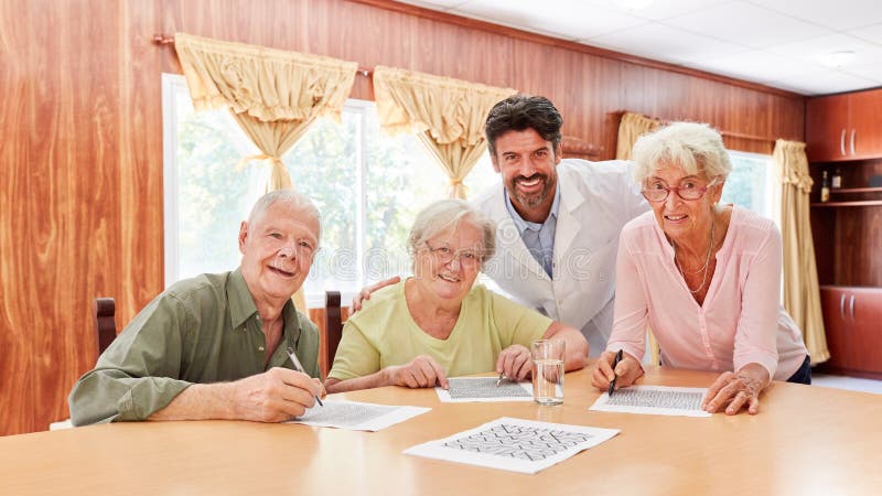 Group of Seniors and Geriatric Nurses on Game Night Stock Photo - Image ...