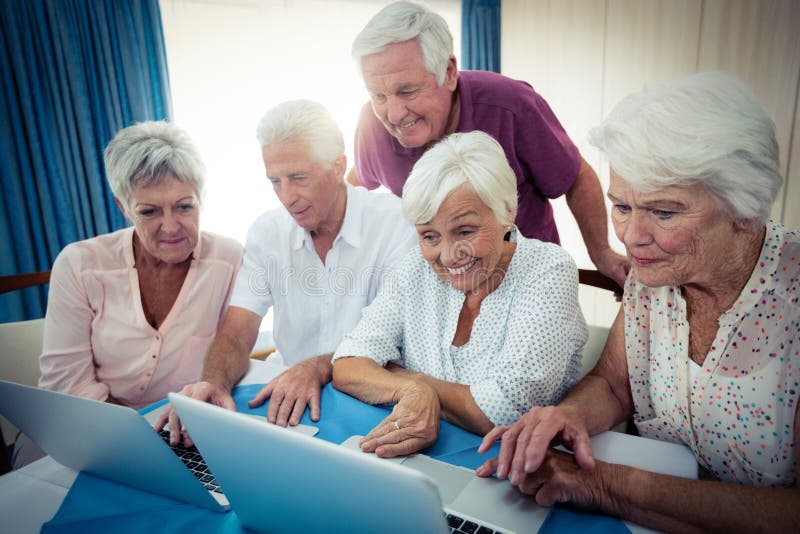 Group of Seniors Using a Computer Stock Image - Image of aged, helping ...