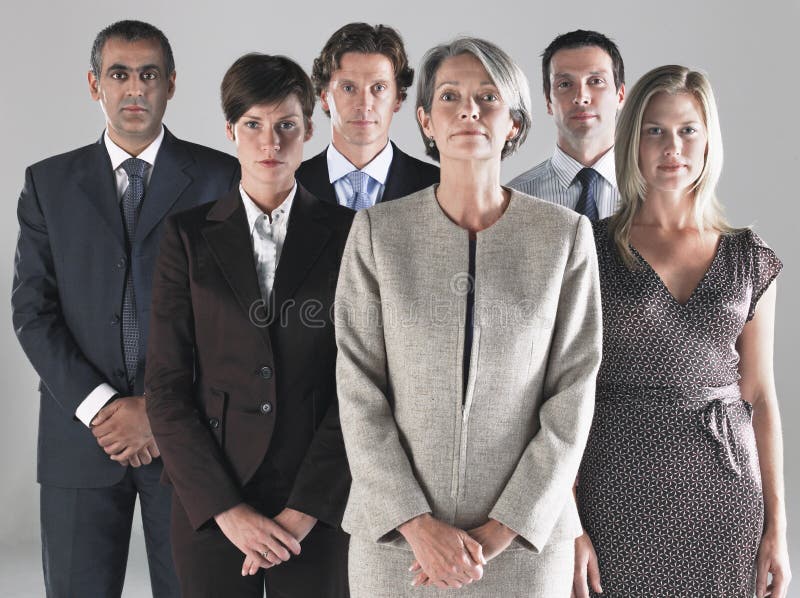 Serious Businesspeople, Standing, Looking Down Stock Photo - Image of ...