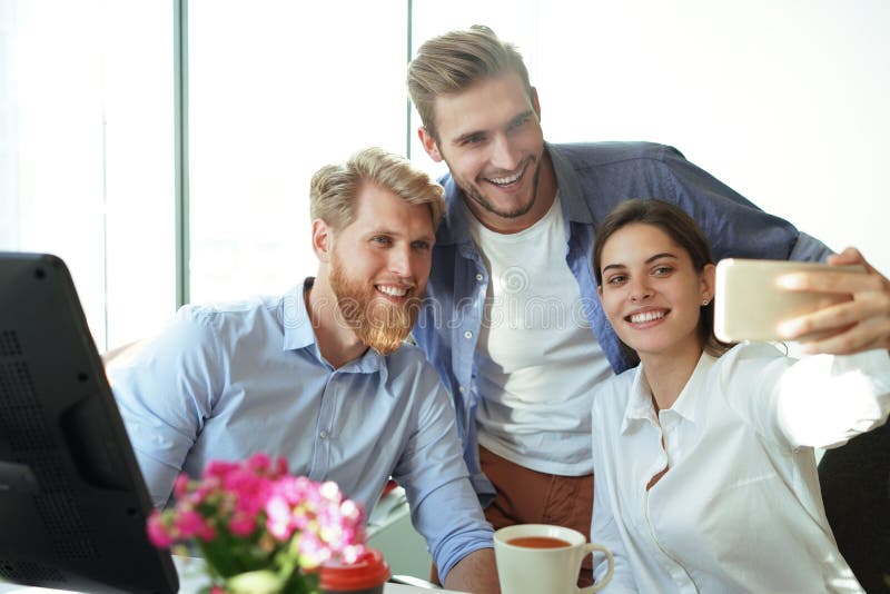 Group Shot of Colleagues Having Fun in Their Office. Stock Image ...