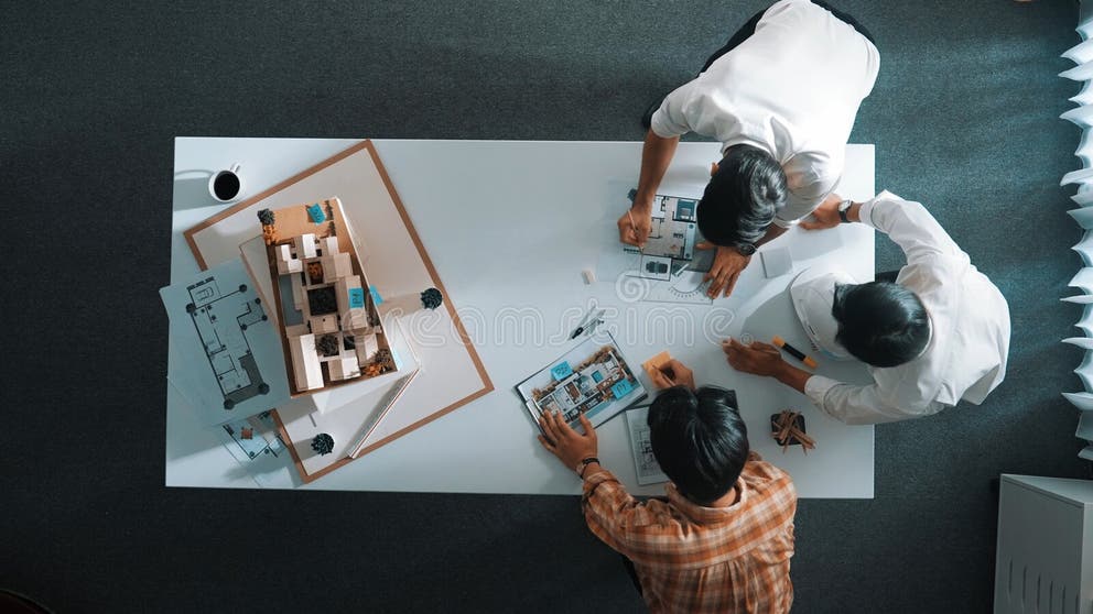 Group of Designer Look at Model while Discussing about Building ...