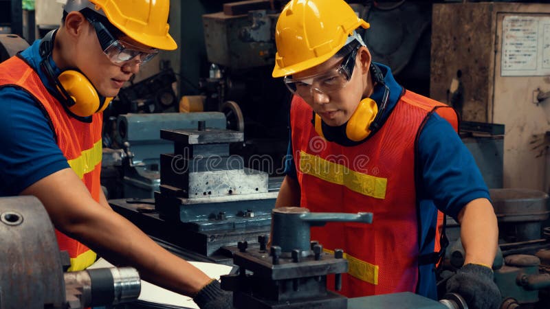 Group of Skillful Factory Workers Using Machine Equipment in Workshop ...
