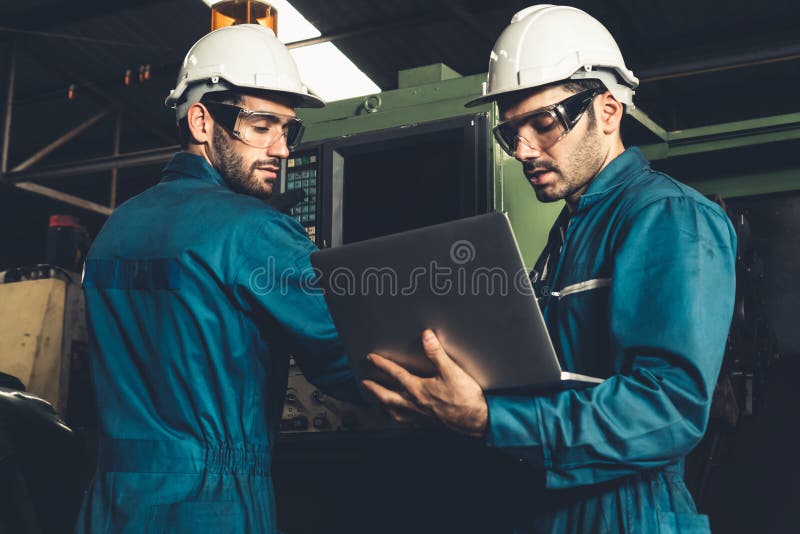 Group of Skillful Factory Workers Using Machine Equipment in Workshop ...