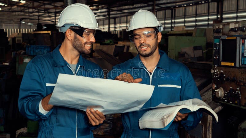 Group of Skillful Factory Workers Using Machine Equipment in Workshop ...
