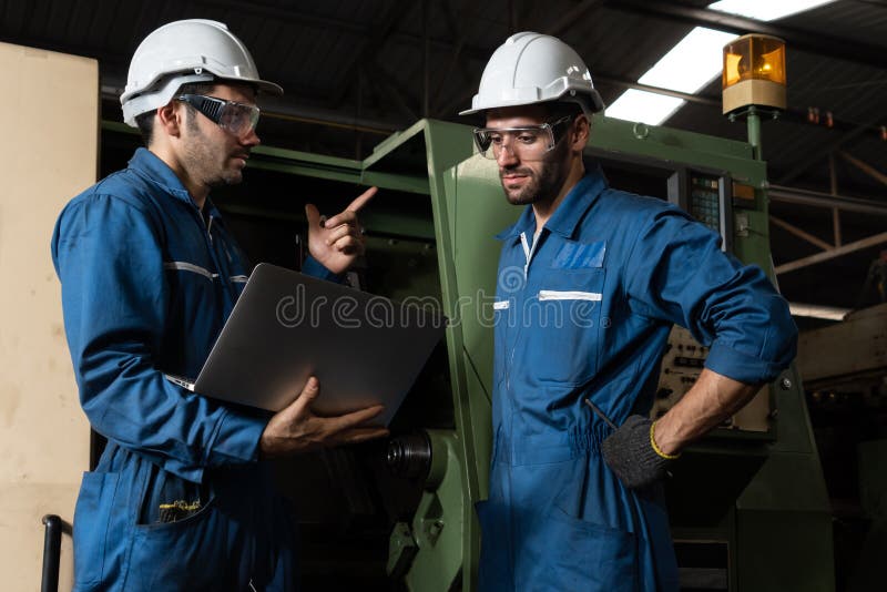 Group of Skillful Factory Workers Using Machine Equipment in Workshop ...