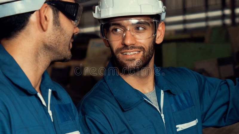 Group of Skillful Factory Workers Using Machine Equipment in Workshop ...