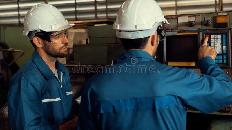 Group of Skillful Factory Workers Using Machine Equipment in Workshop ...