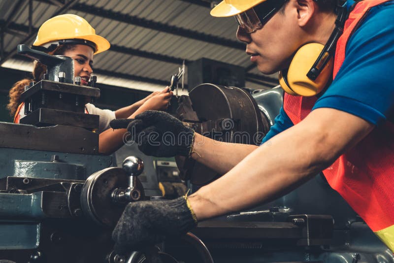 Group of Skillful Workers Using Machine Equipment in Factory Workshop ...