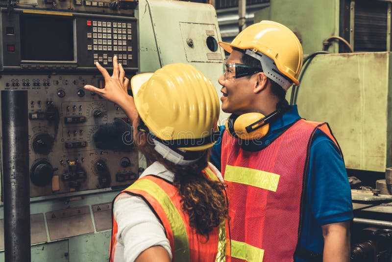 Group of Skillful Workers Using Machine Equipment in Factory Workshop ...