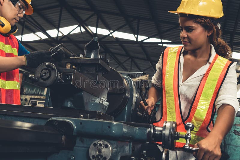 Group of Skillful Workers Using Machine Equipment in Factory Workshop ...