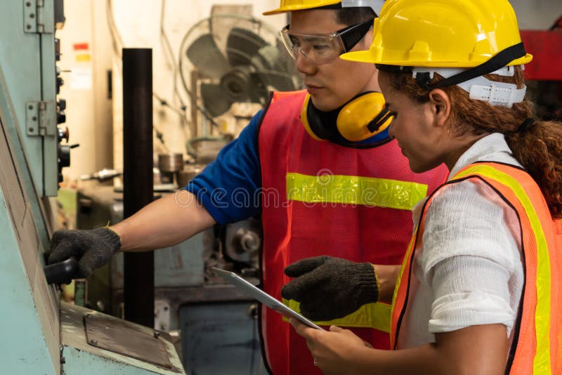 Group of Skillful Workers Using Machine Equipment in Factory Workshop ...