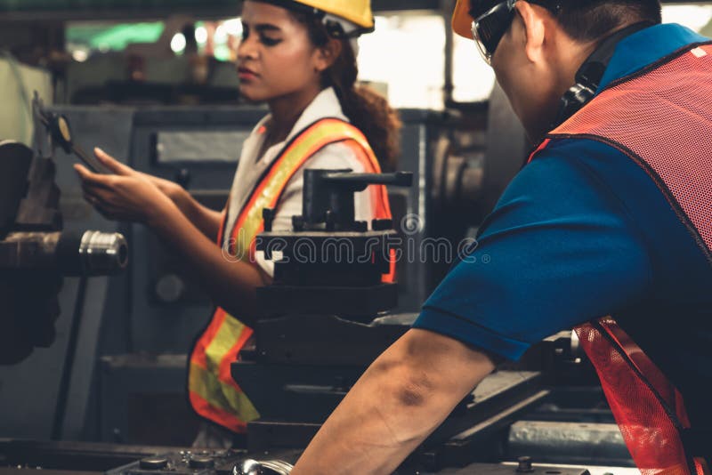 Group of Skillful Workers Using Machine Equipment in Factory Workshop ...