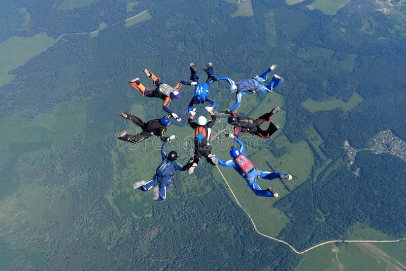 A Group of Skydivers Above White Big Cloud. Stock Image - Image of ...