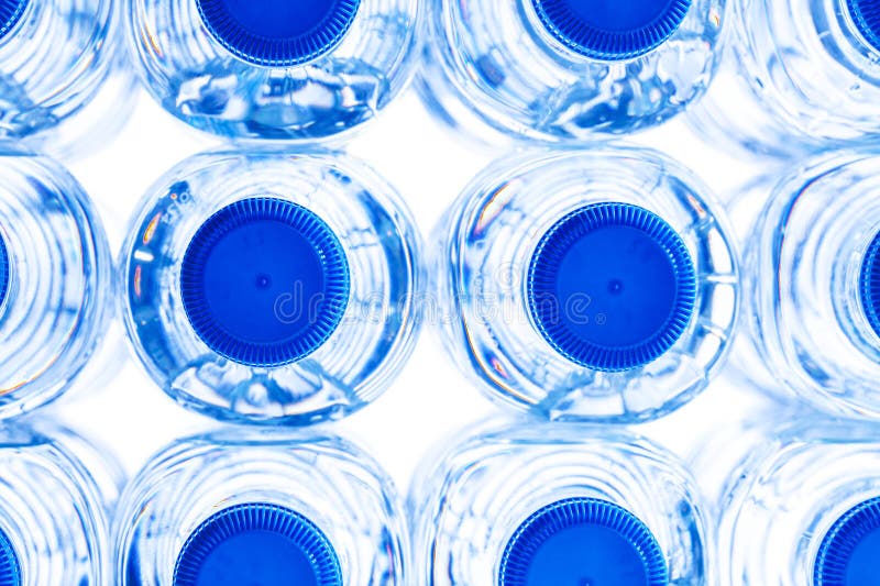 Group of Small Plastic Water Bottles with Blue Cap Stock Image - Image ...