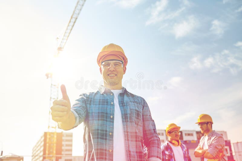 Group of Smiling Builders in Hardhats Outdoors Stock Photo - Image of ...