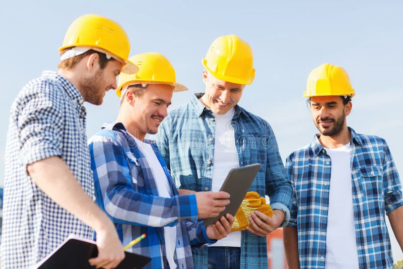 Group of Smiling Builders with Tablet Pc Outdoors Stock Photo - Image ...