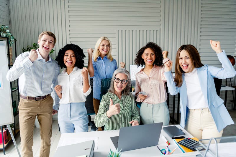 Team Celebrating Success in Modern Office Space with Enthusiastic ...