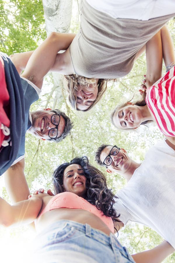 Group of Smiling Friends in Circle - Bottom View Stock Image - Image of ...