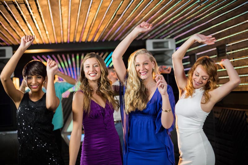 Group of Smiling Friends Dancing on Dance Floor Stock Image - Image of ...