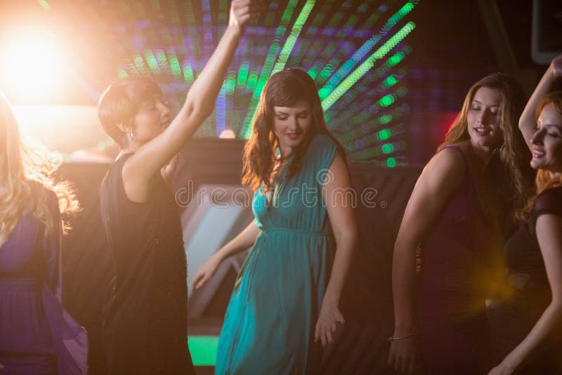 Group of Smiling Friends Dancing on Dance Floor Stock Photo - Image of ...