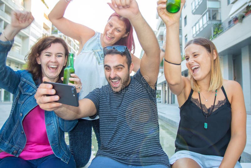 Group of Smiling Friends Watch the Tablet and Exult Stock Image - Image ...