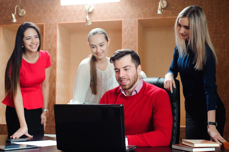 Group of Smiling Inspired Young Business People Working Together in ...