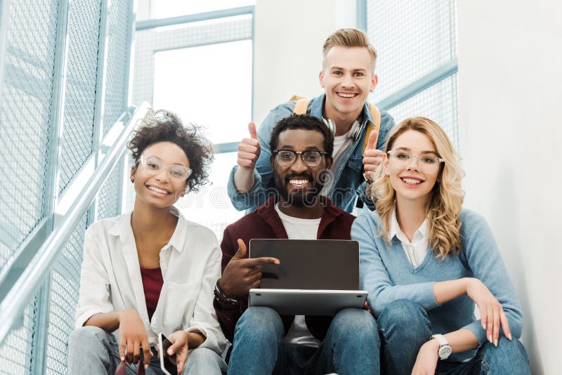 Group of Smiling Multicultural Students with Laptop Showing Thumbs Up ...