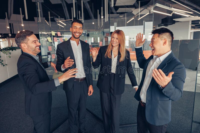 Group of Smiling Multietnic Colleagues Talking Together during Break ...