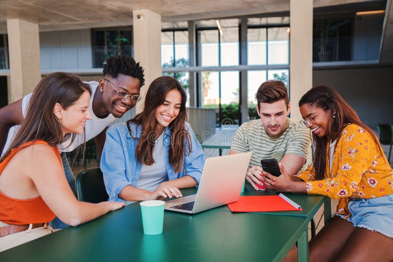 Group of Smiling Multiracial International Students Learning with a ...