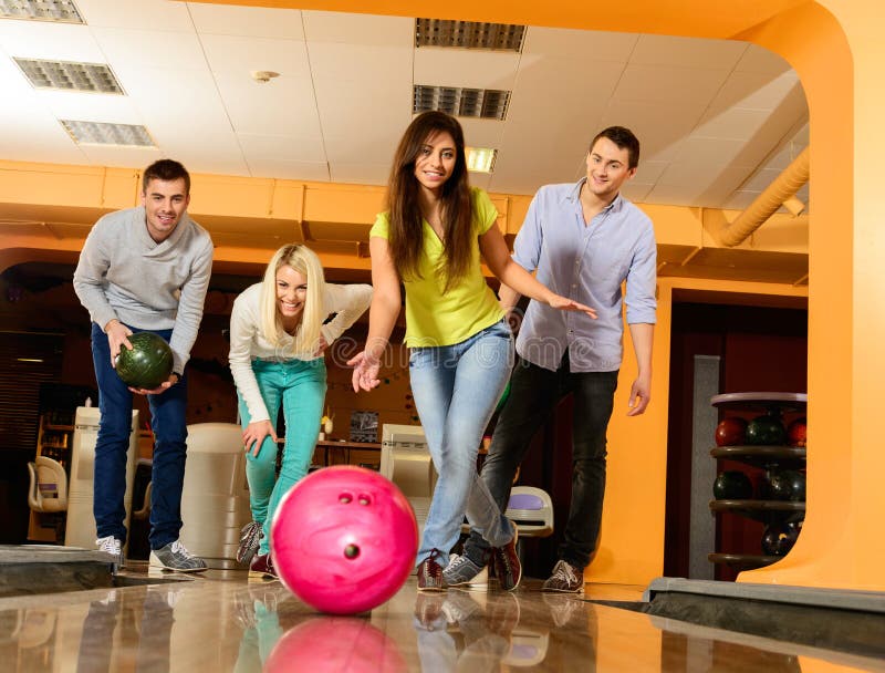 Group of Smiling People Playing Bowling Stock Image - Image of brunette ...