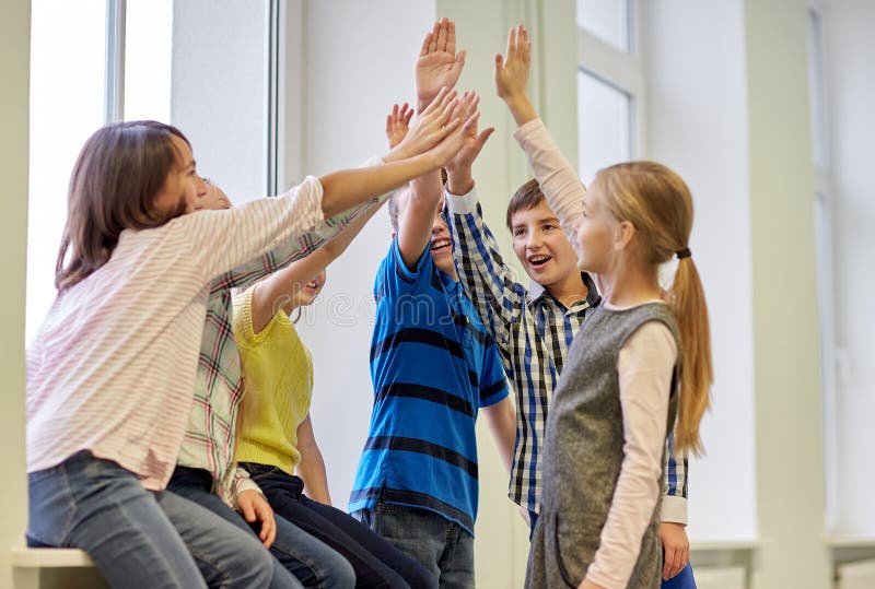 Group of Smiling School Kids Making High Five Stock Image - Image of ...