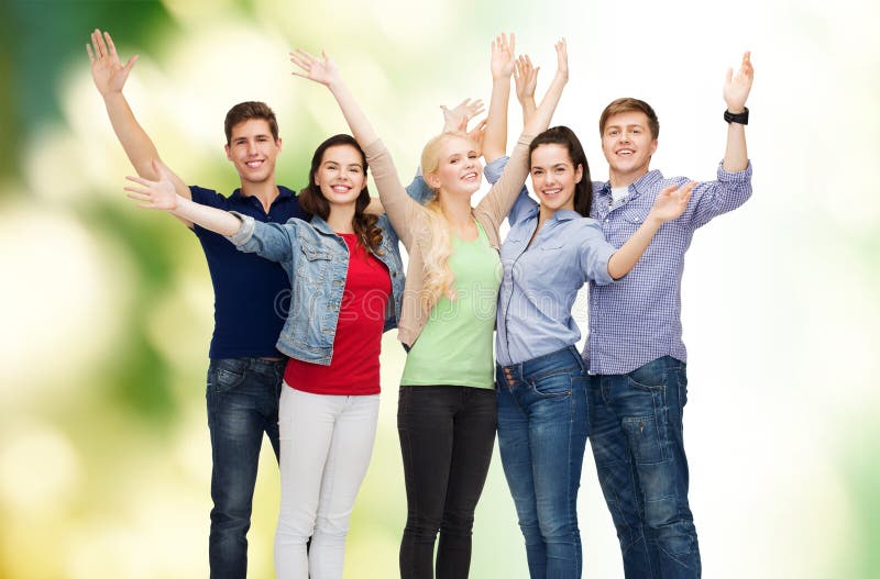 Group of Smiling Students Waving Hands Stock Photo - Image of ...